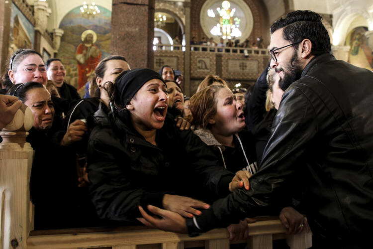 Egyptian Christians left to bury their dead after church bombings ... Egyptian Christians left to bury their dead after church bombings ...